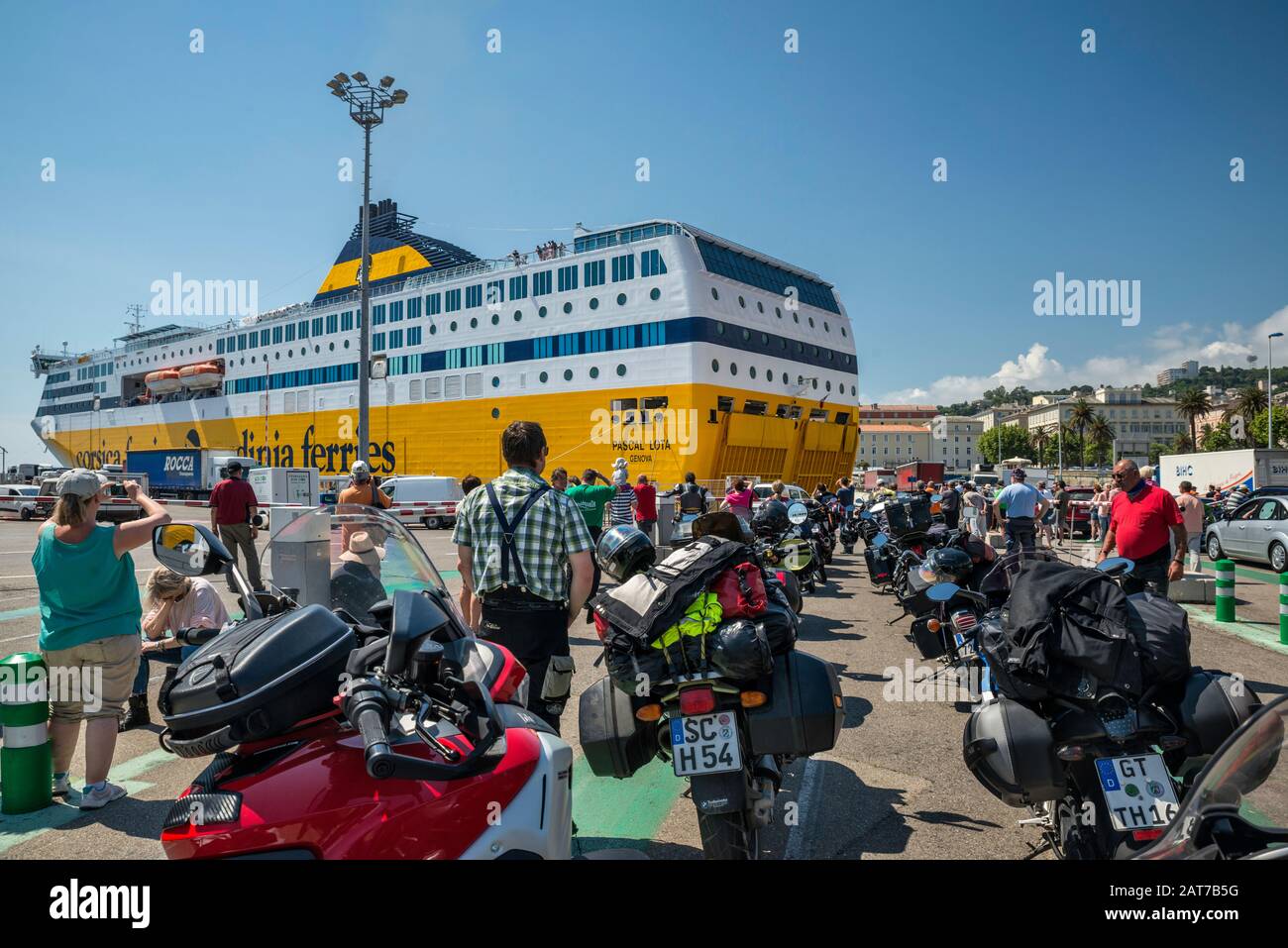Motorcycles in lines waiting to board MS Pascal Lota, at ferry terminal ...