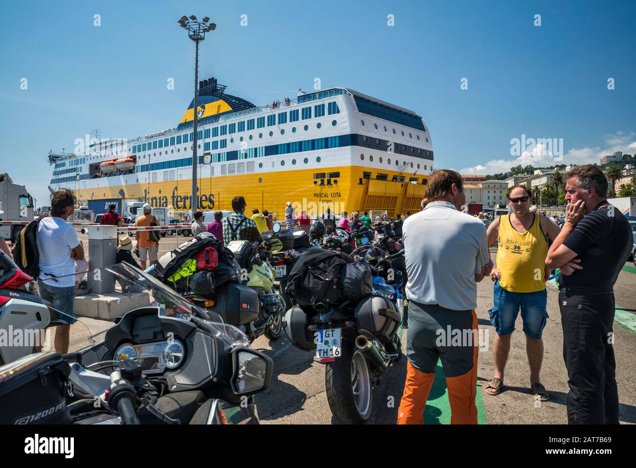 Bikers with their motorcycles waiting to board MS Pascal Lota, at ferry ...