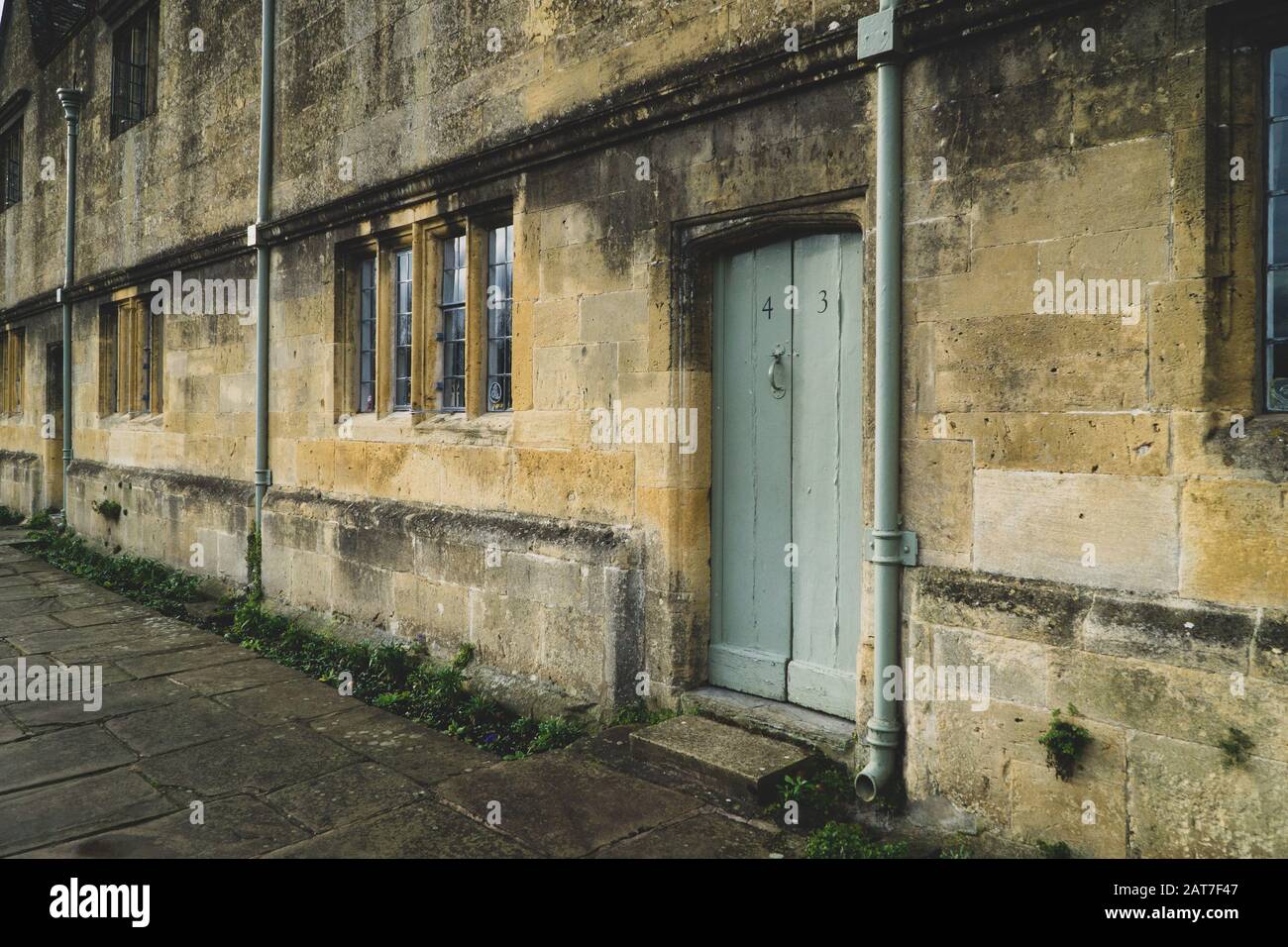 Old, dark, spooky looking front of a Cotswold building Stock Photo - Alamy