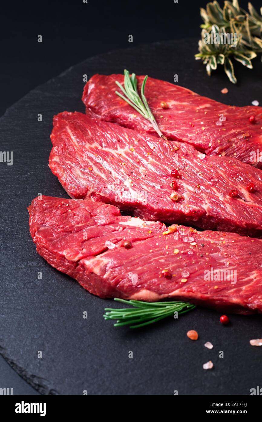 Food concept organic raw meat filet beef steak on black slate stone ...