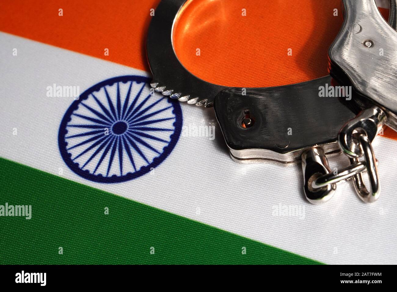 Handcuff on the flag of India. Close-up, copy space Stock Photo - Alamy
