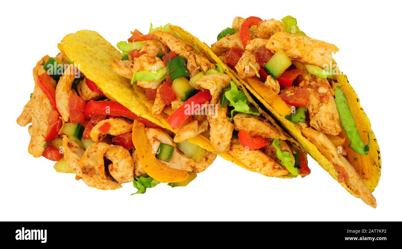 Fried chicken and vegetable filled tacos isolated on a white background ...