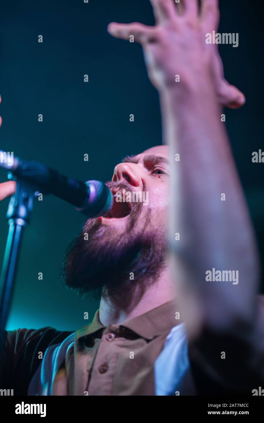 Singer with raised hands Stock Photo - Alamy