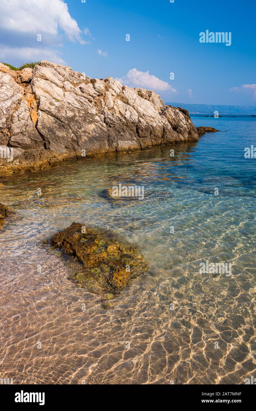 The transparent seewater of Sardinia in the Lazzareto Beach of Alghero ...