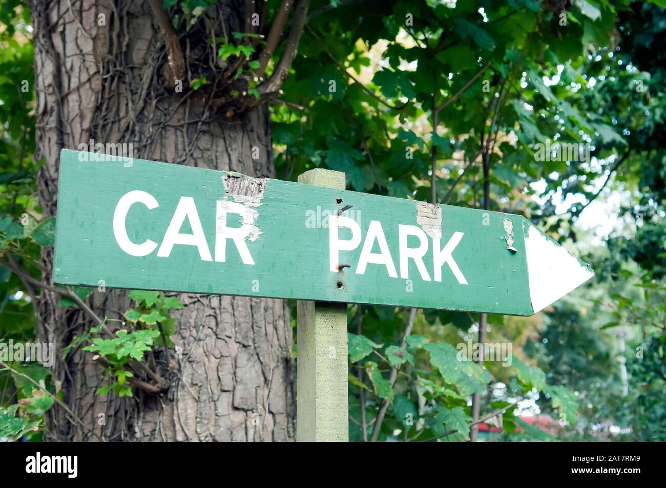 An old sign showing people where the car park is, which is shaped like ...