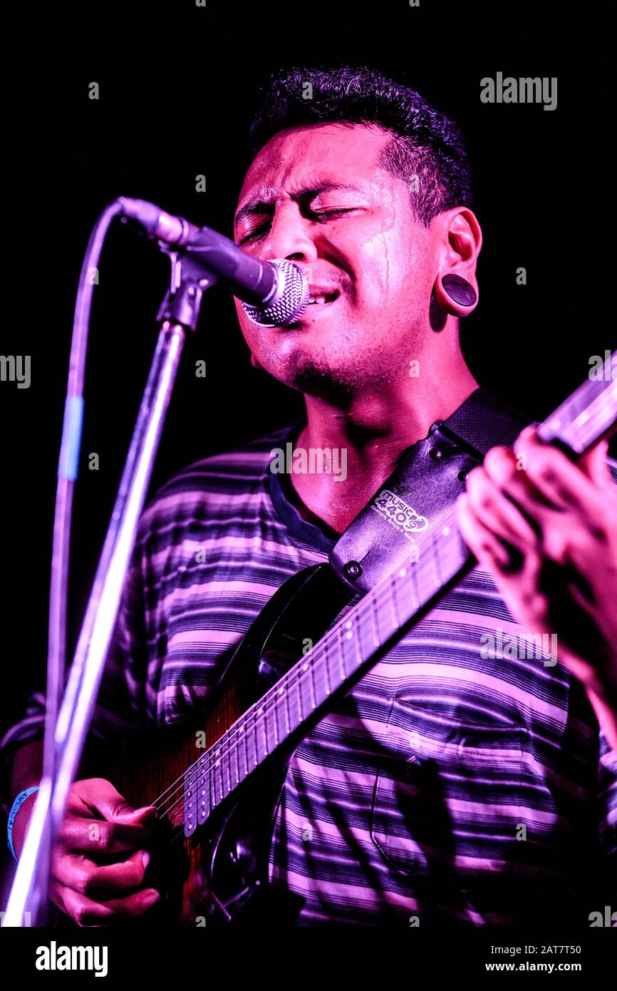 Pacific Islander man sings plays guitar Stock Photo - Alamy