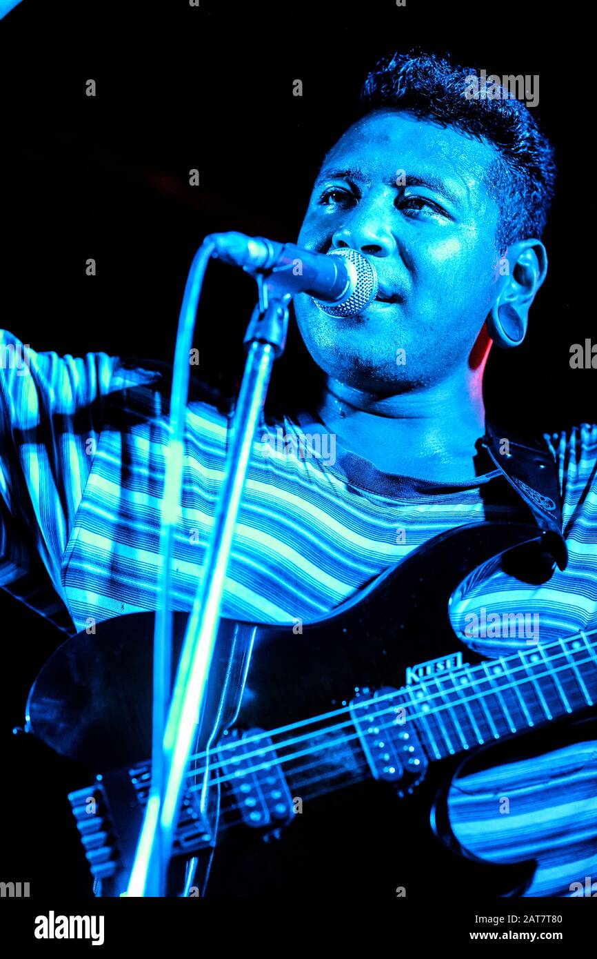 Pacific Islander man sings plays guitar Stock Photo - Alamy