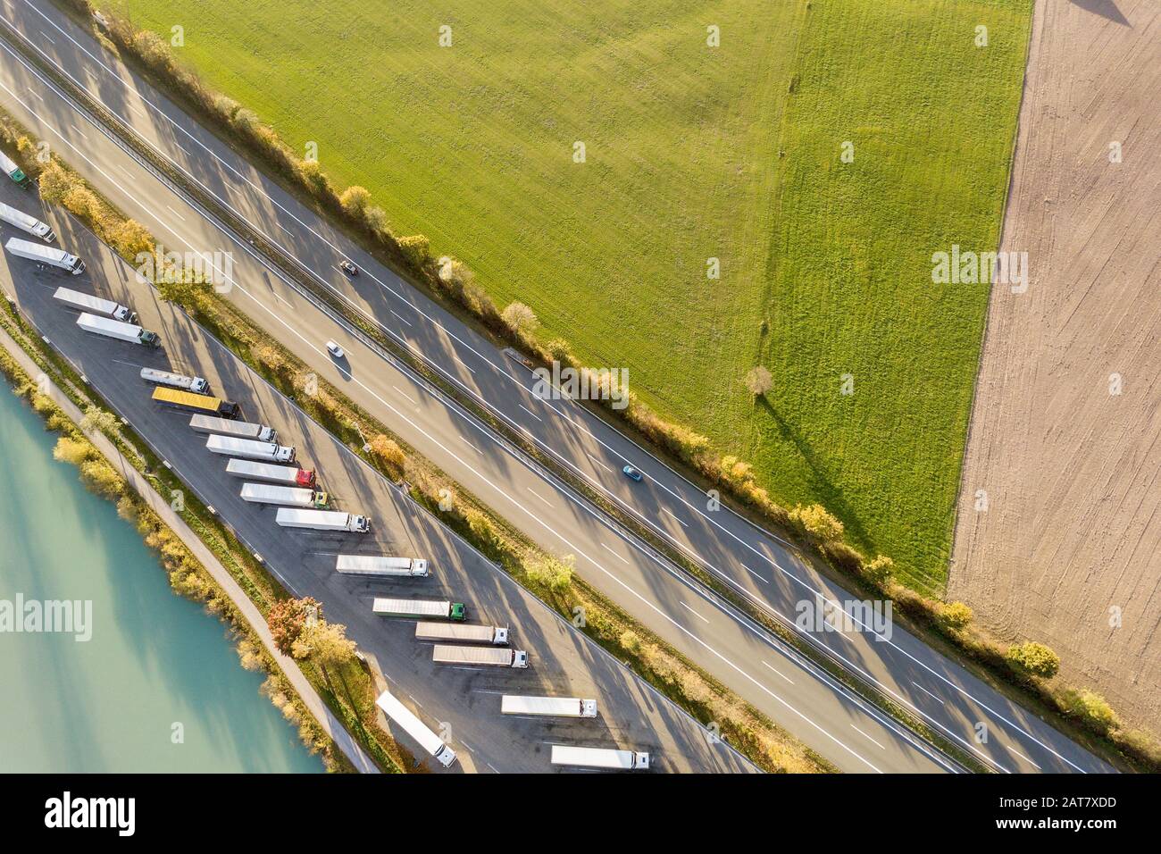 Top down aerial view of highway interstate road with fast moving ...