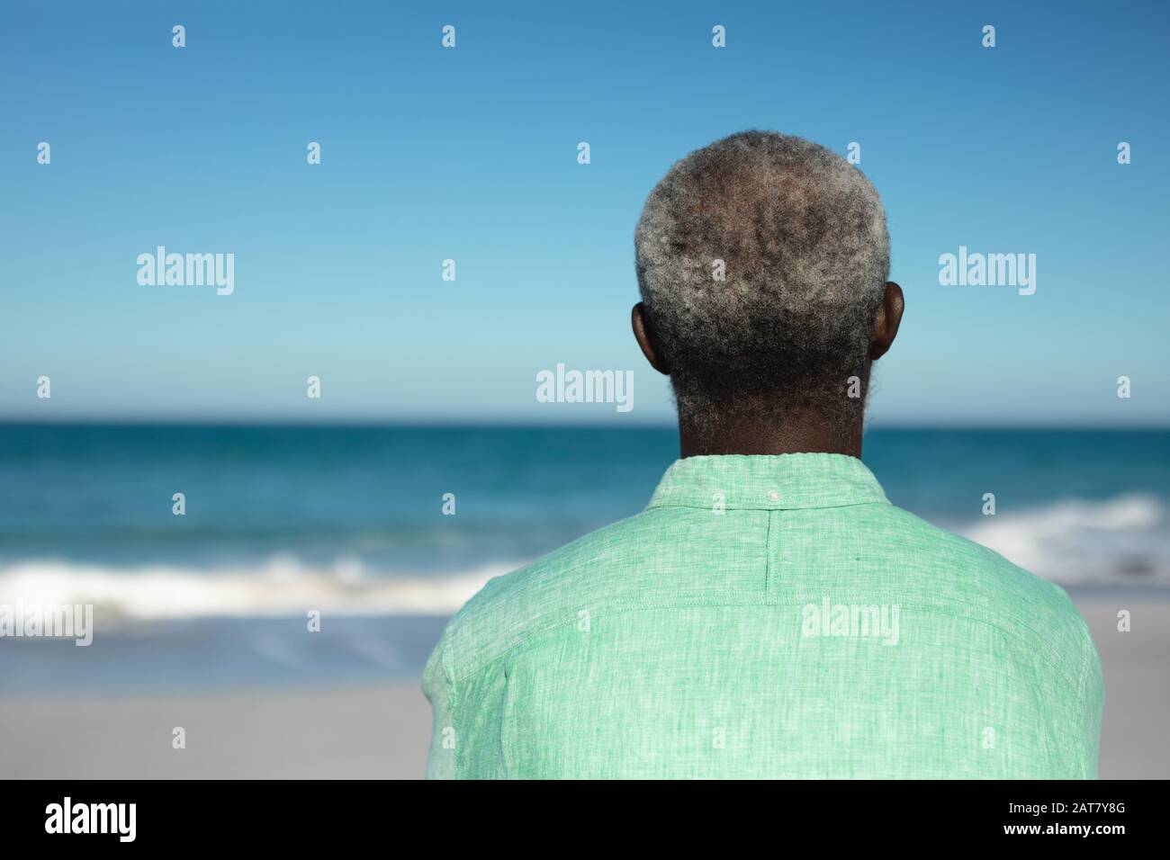 Rear view old man at the beach Stock Photo - Alamy