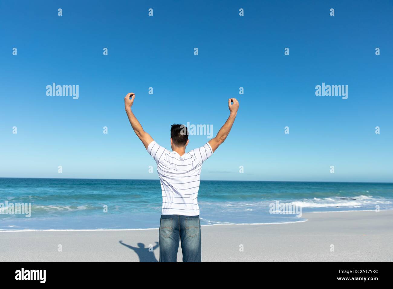 Young man relaxing at the beach Stock Photo - Alamy