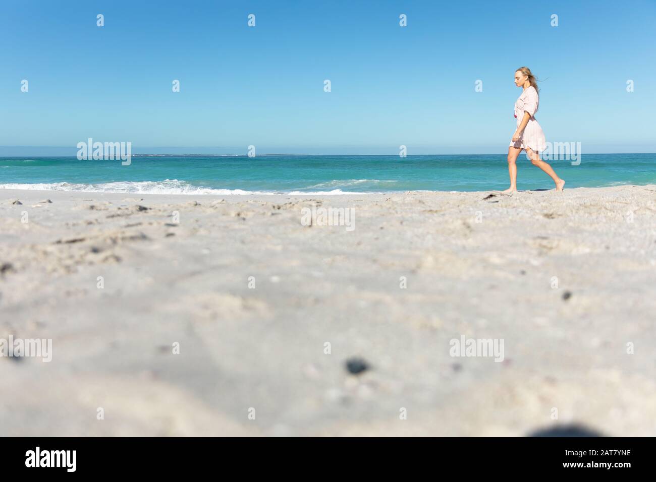 Side view of young woman at the beach Stock Photo - Alamy