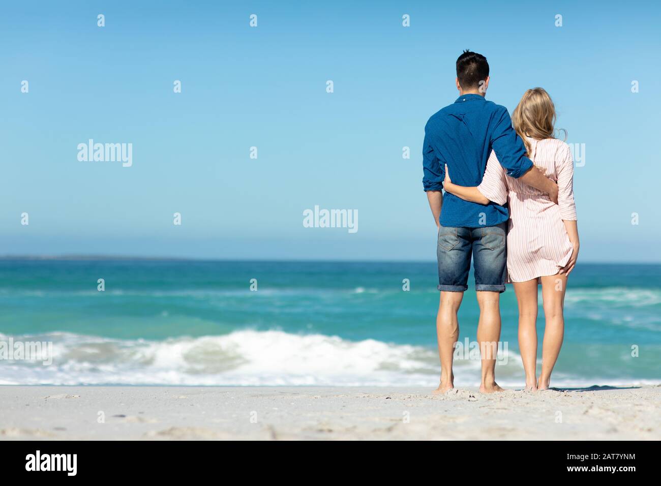 Young man and young woman looking at sea view hi-res stock photography ...