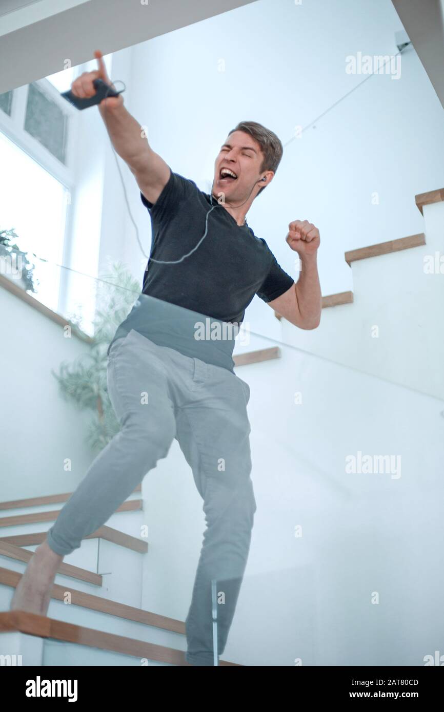 Guy listening music dancing walking hi-res stock photography and images ...