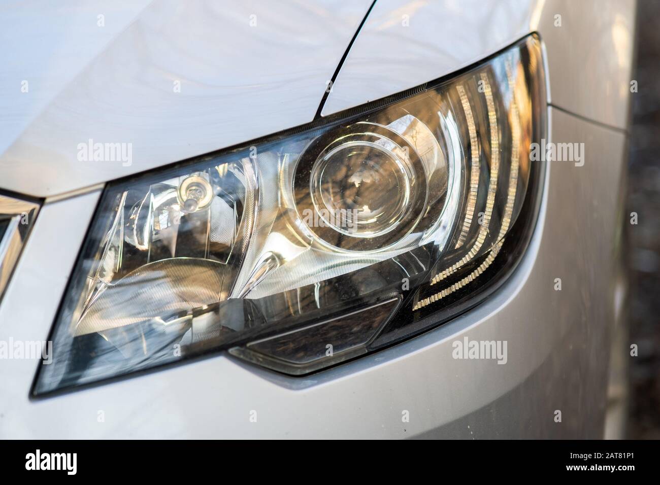 Close up view of modern car headlight with shiny optics Stock Photo - Alamy
