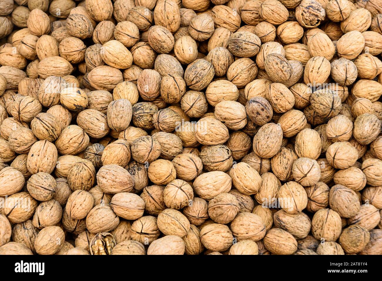 Top view of whole walnuts as background texture Stock Photo - Alamy