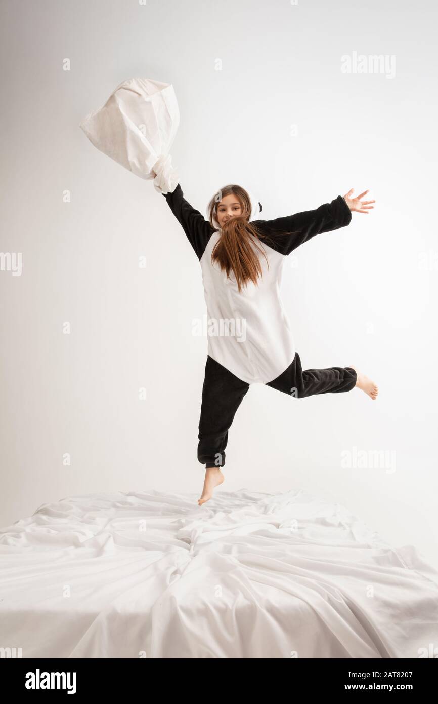 Little girl in soft warm pajama colored bright playing at home. Cute ...