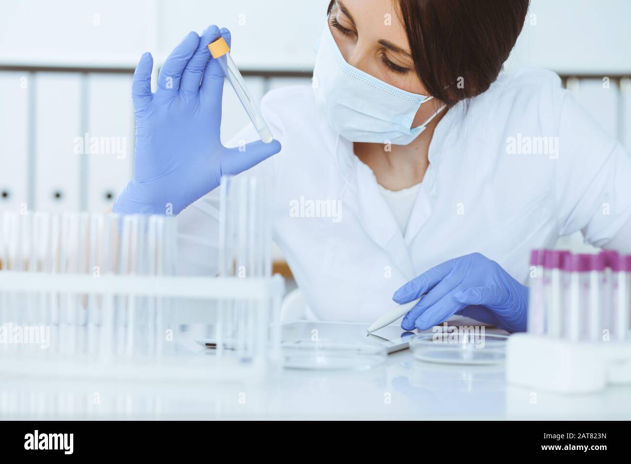 Close Up Of Professional Female Scientist In Protective Eyeglasses