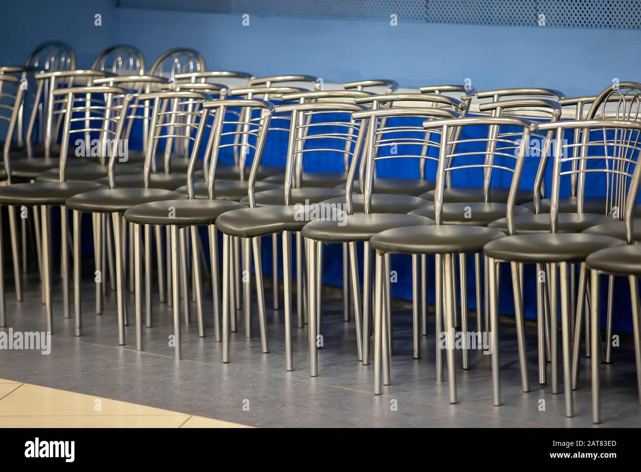 Many chairs stand in a row Stock Photo - Alamy