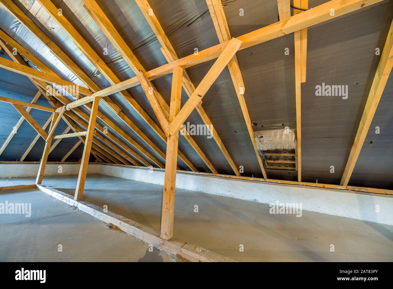 Attic of a building with wooden beams of a roof structure Stock Photo ...