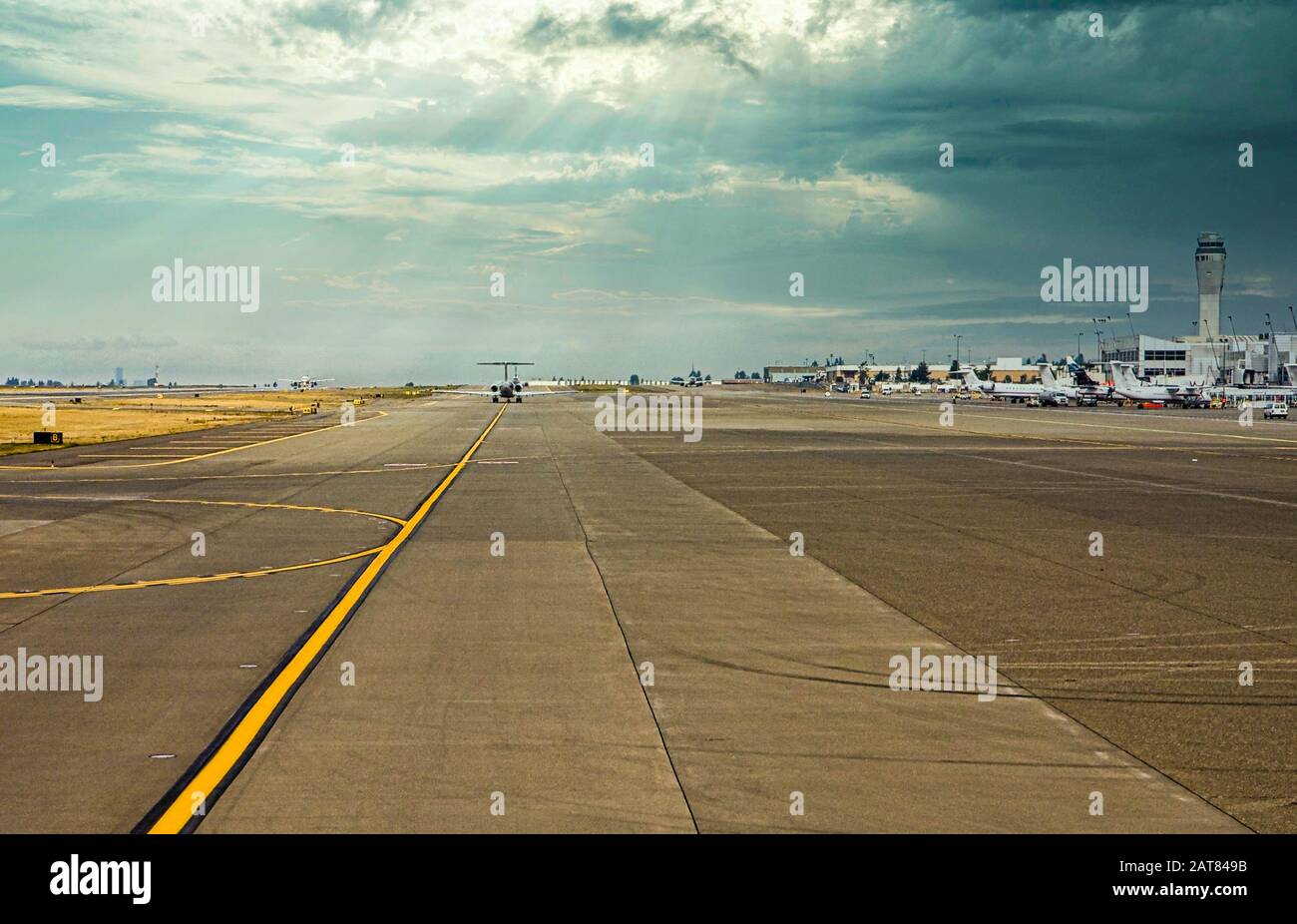 View Down the Runway Toward Sun Stock Photo - Alamy