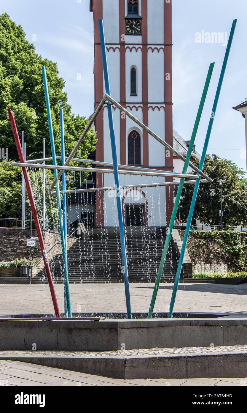 colorful fountain in front of church Stock Photo - Alamy