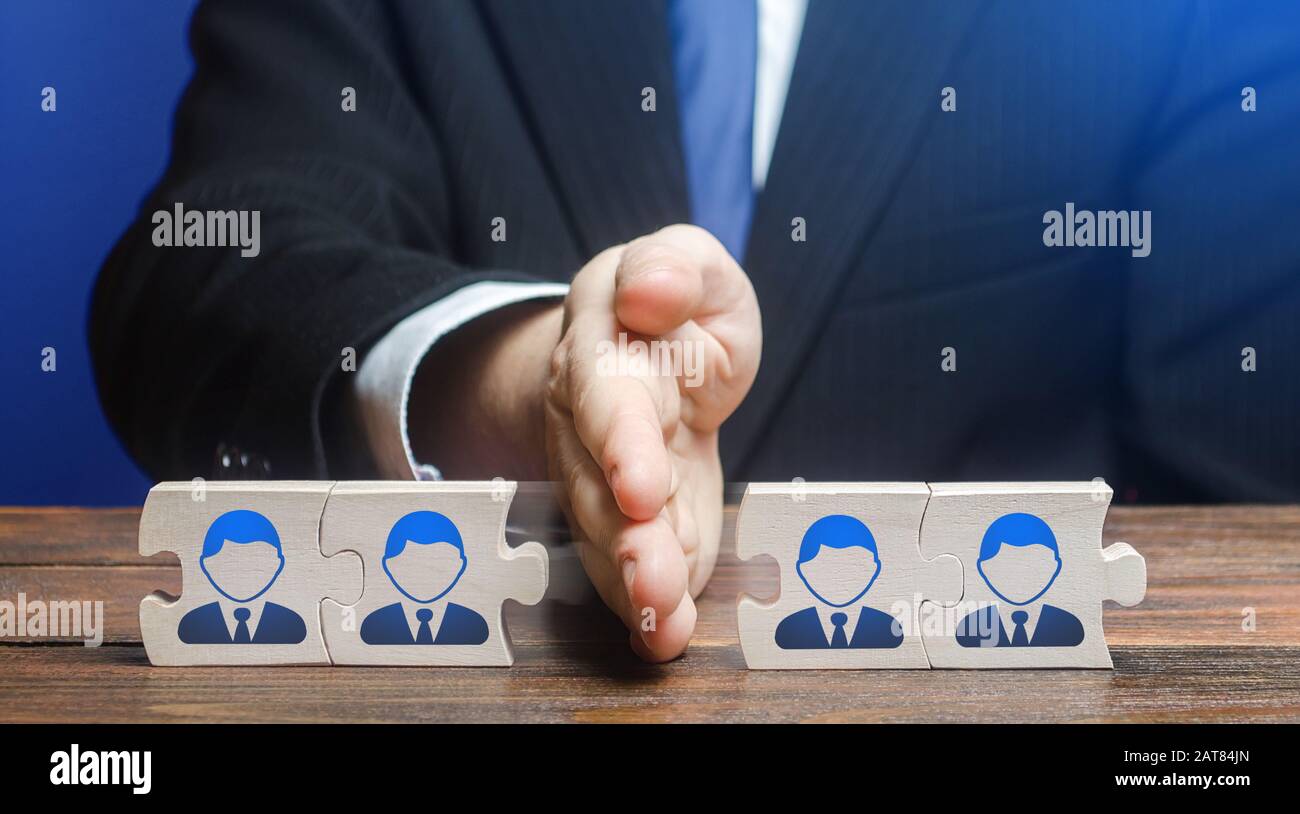 A man divides puzzle team of employees. Team split, structural ...