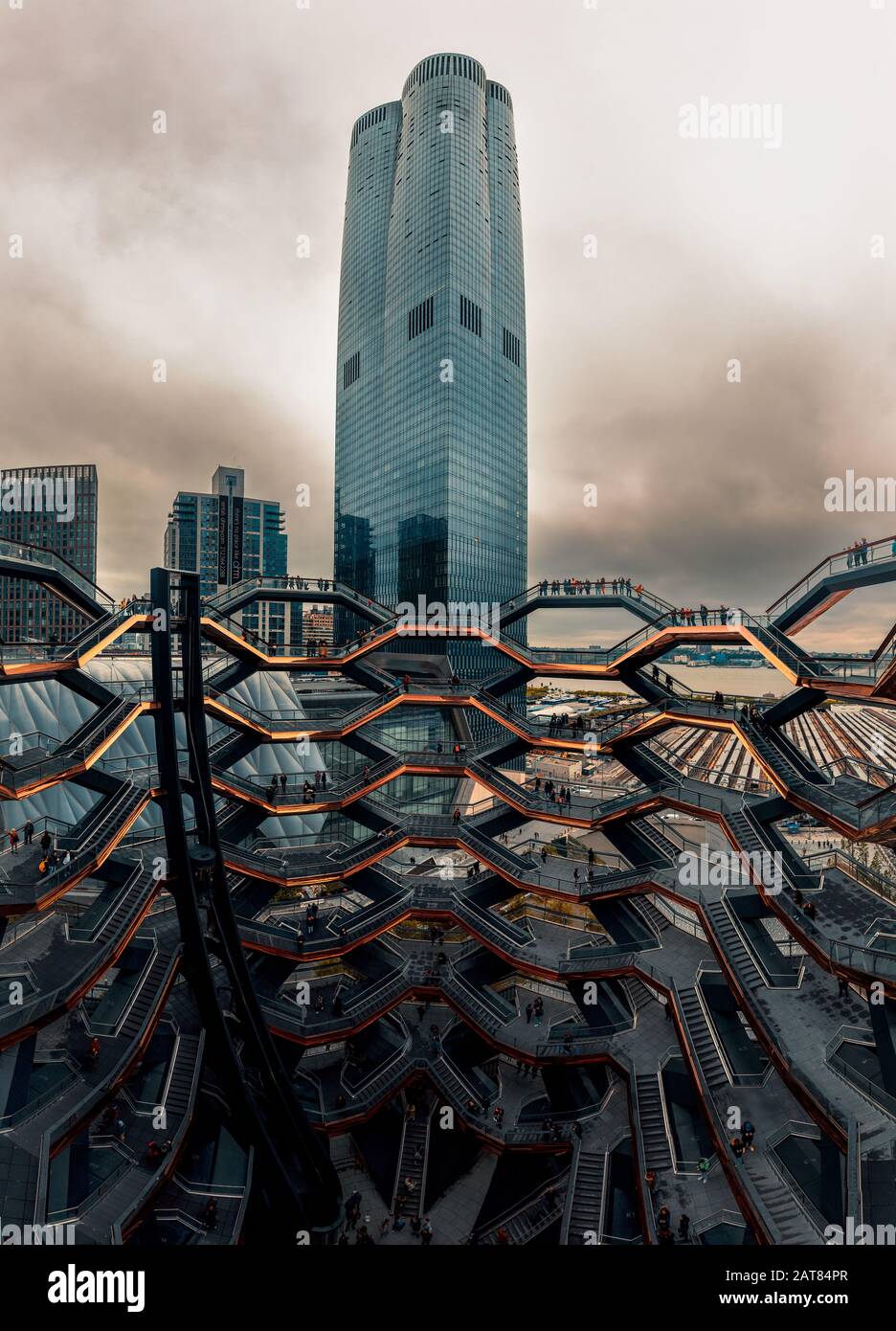 A dramatic sky highlights the hexagonal structure of the Vessel, which ...