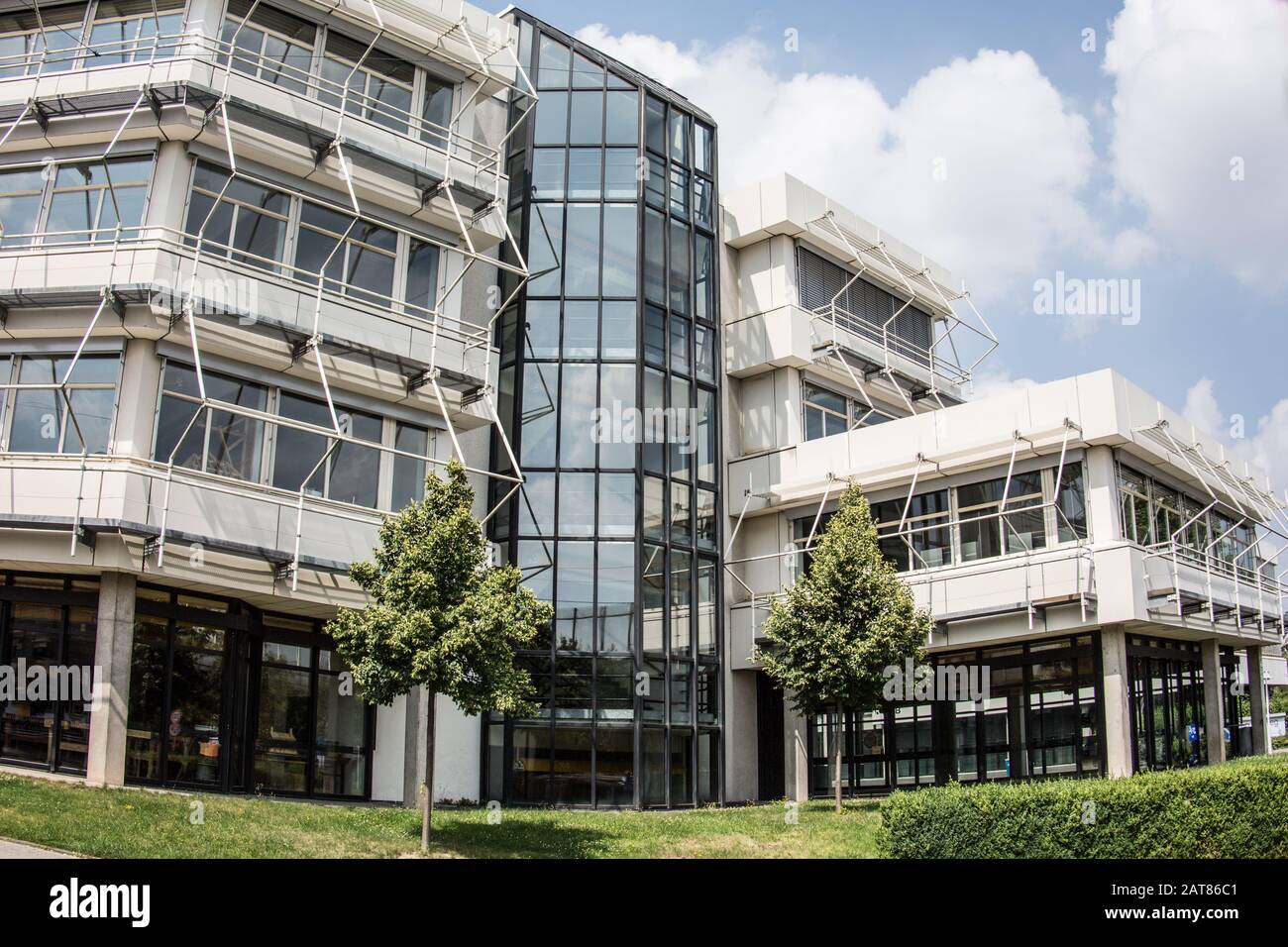 high building with glass facade as a school Stock Photo - Alamy