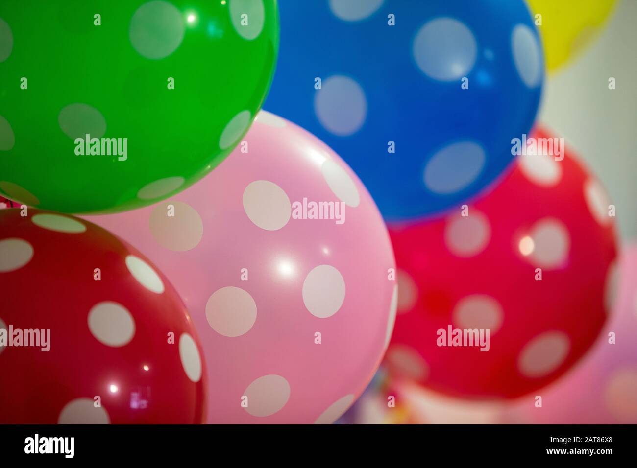 Background inflatable colorful balloons with polka dots Stock Photo - Alamy