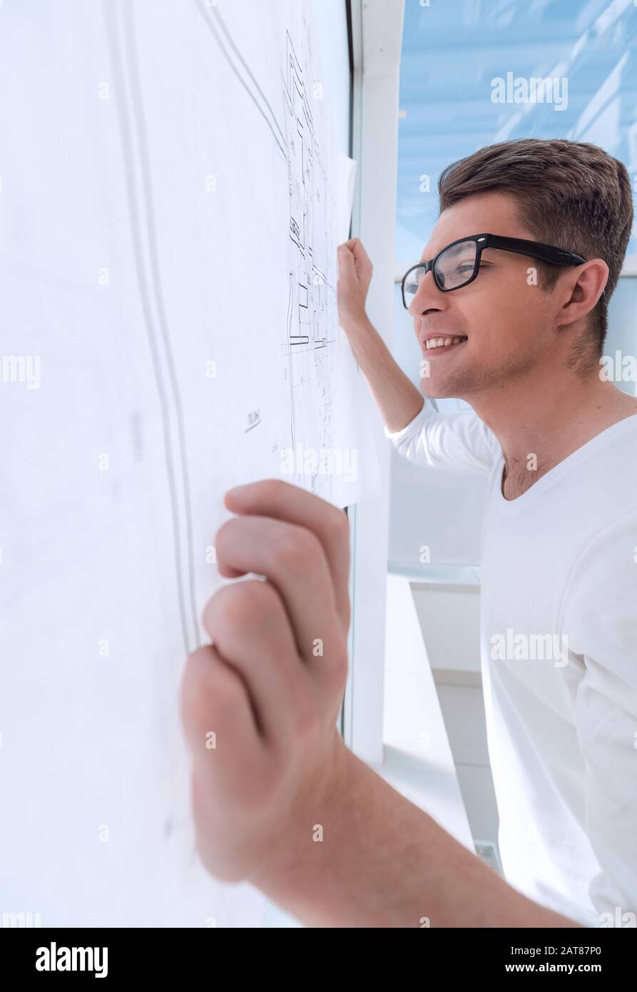 experienced architect studying the blueprint of a new project Stock ...