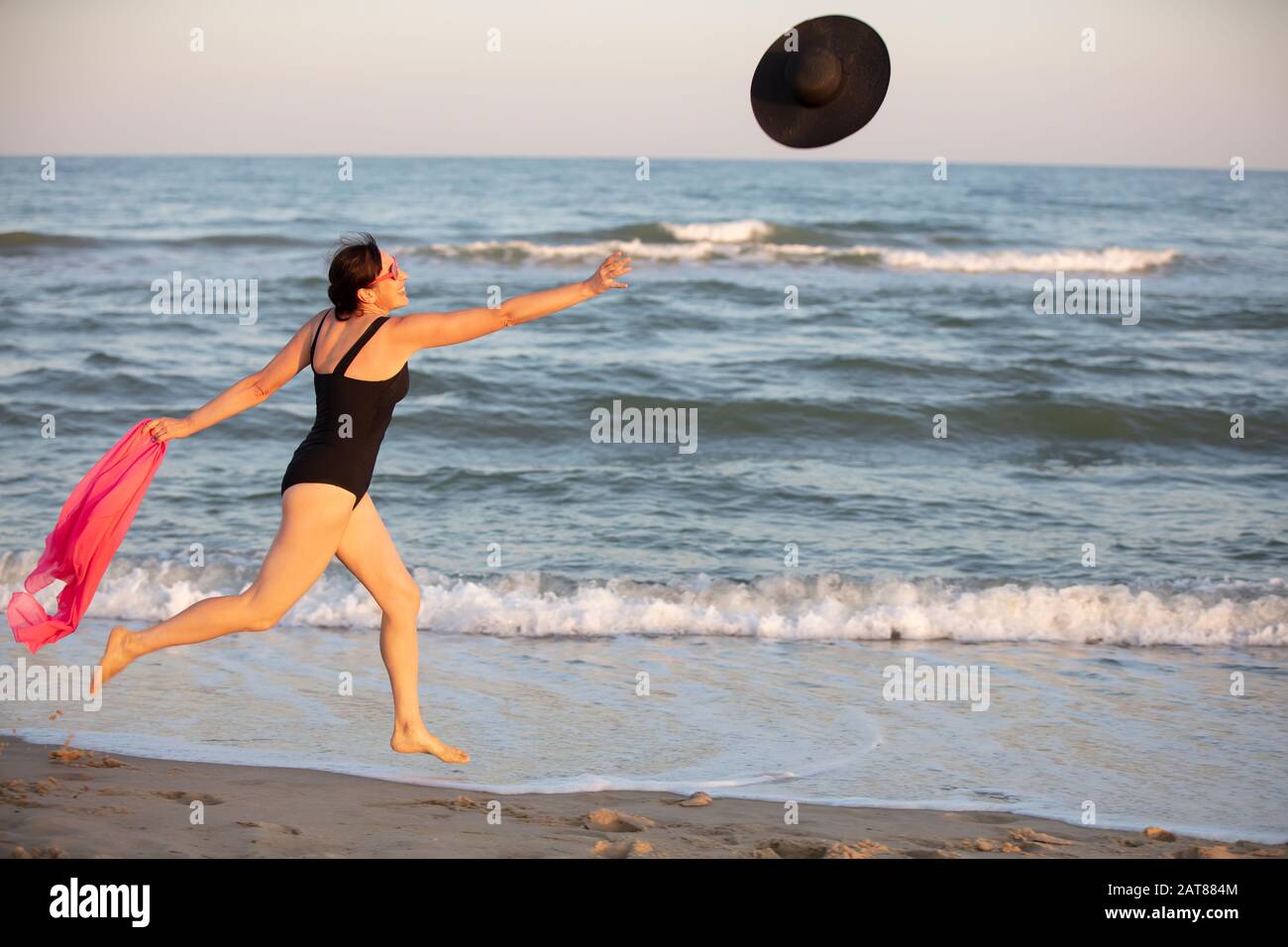 Wind blowing hat off hi-res stock photography and images - Alamy