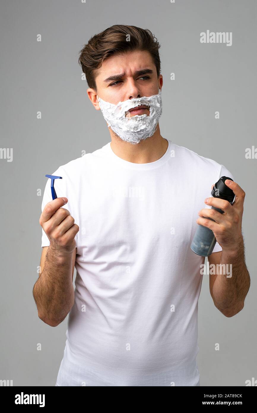 it's time to give up your beard, young man with foam on his face, ready tu shave Stock Photo - Alamy