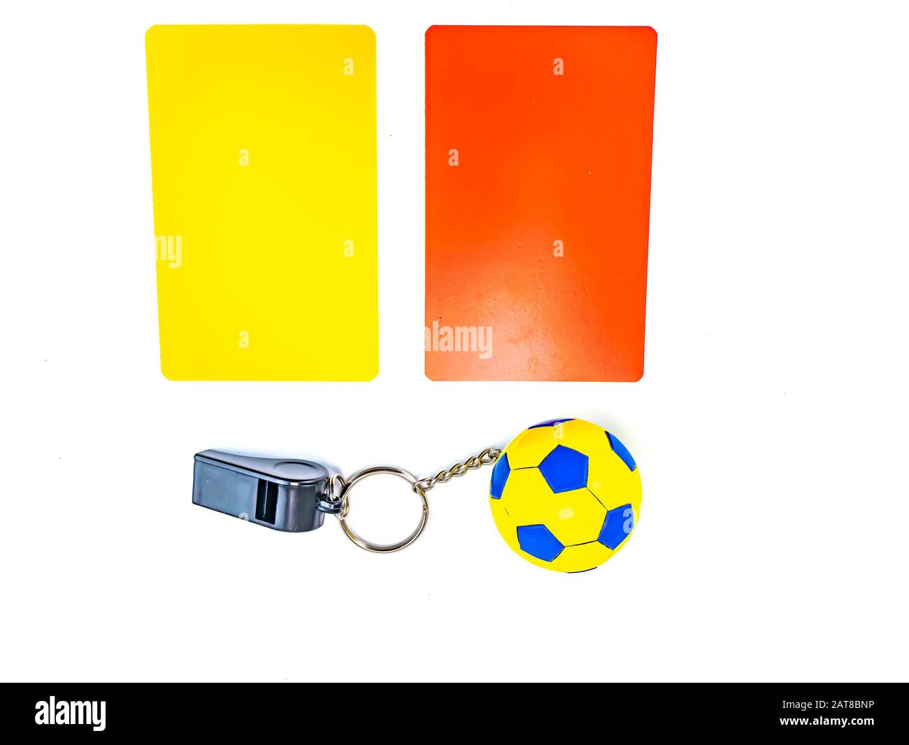 Soccer ball and referee whistle with cards on a white background. Sport ...
