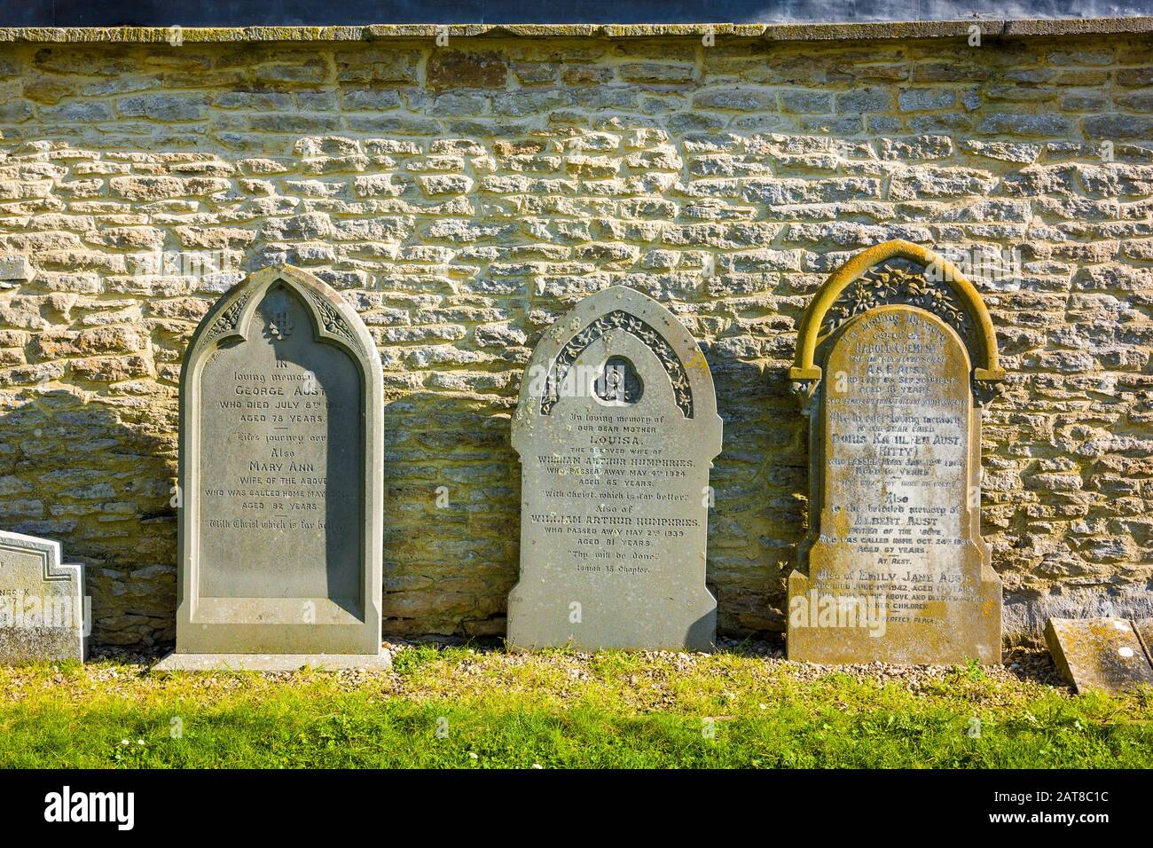 Old gravestones repositioned against a stone wall allowing their ...