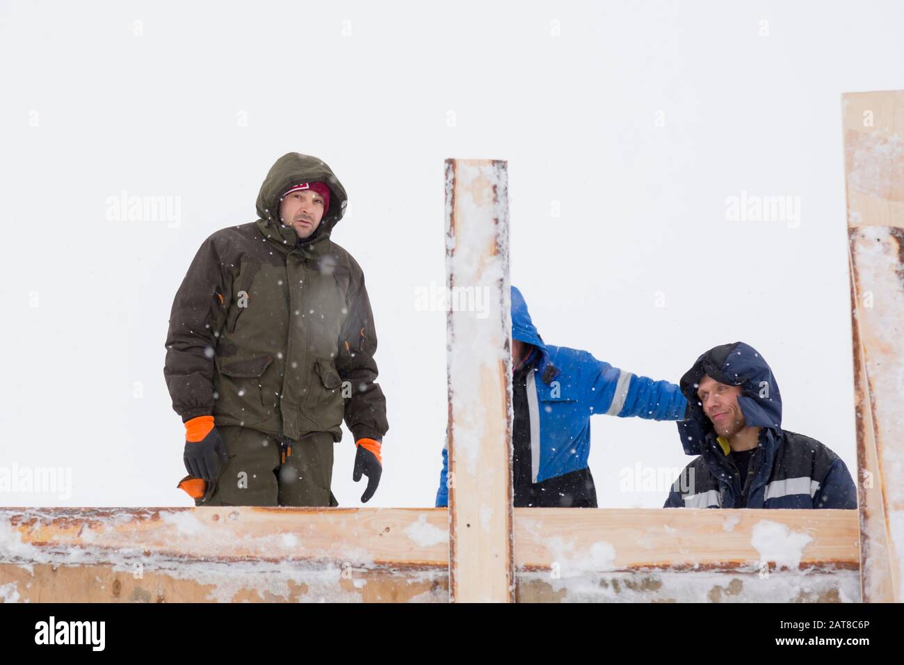 Two workers in overalls at a construction site Stock Photo - Alamy