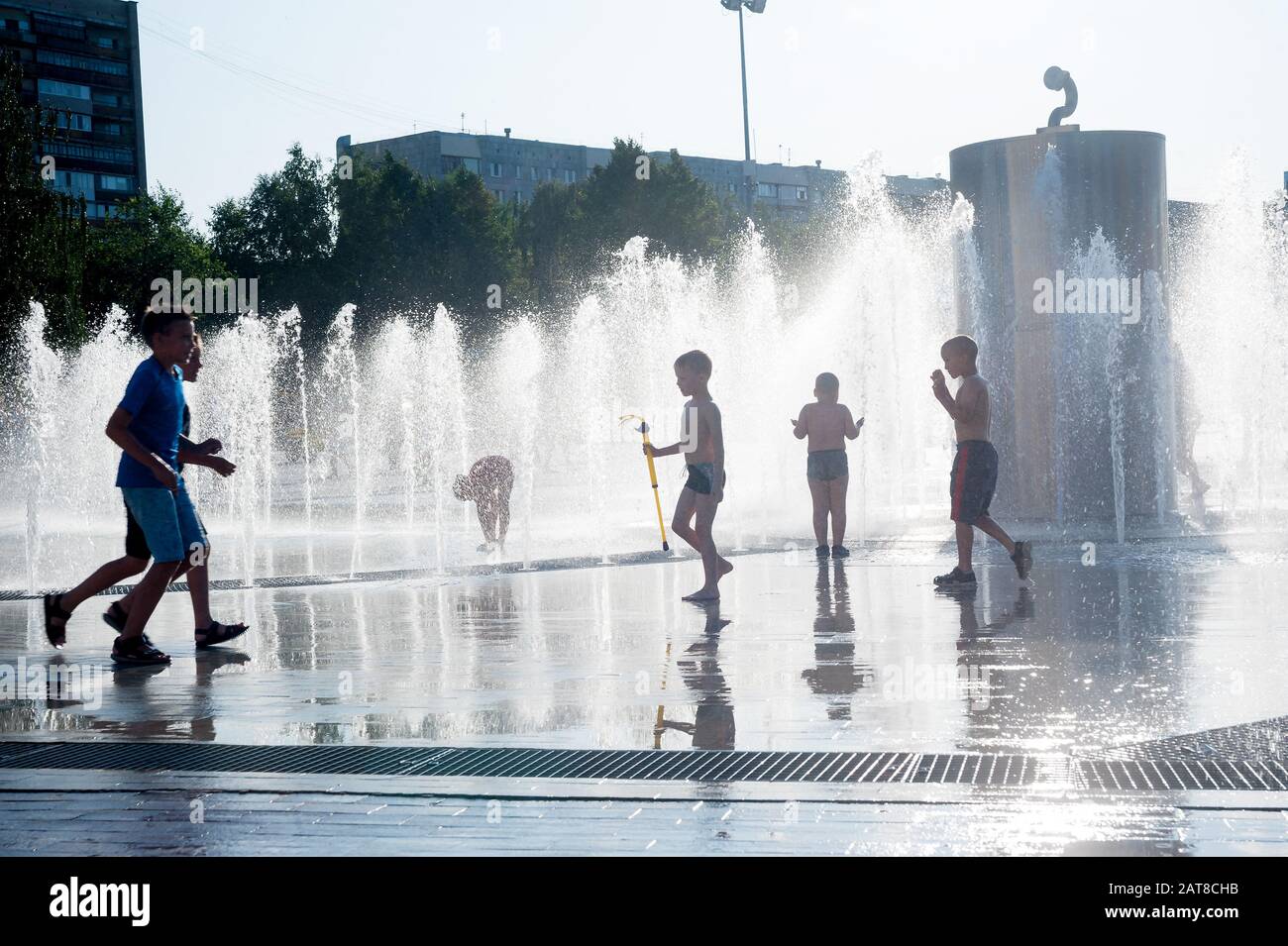 Girl running water fountain hi-res stock photography and images - Alamy