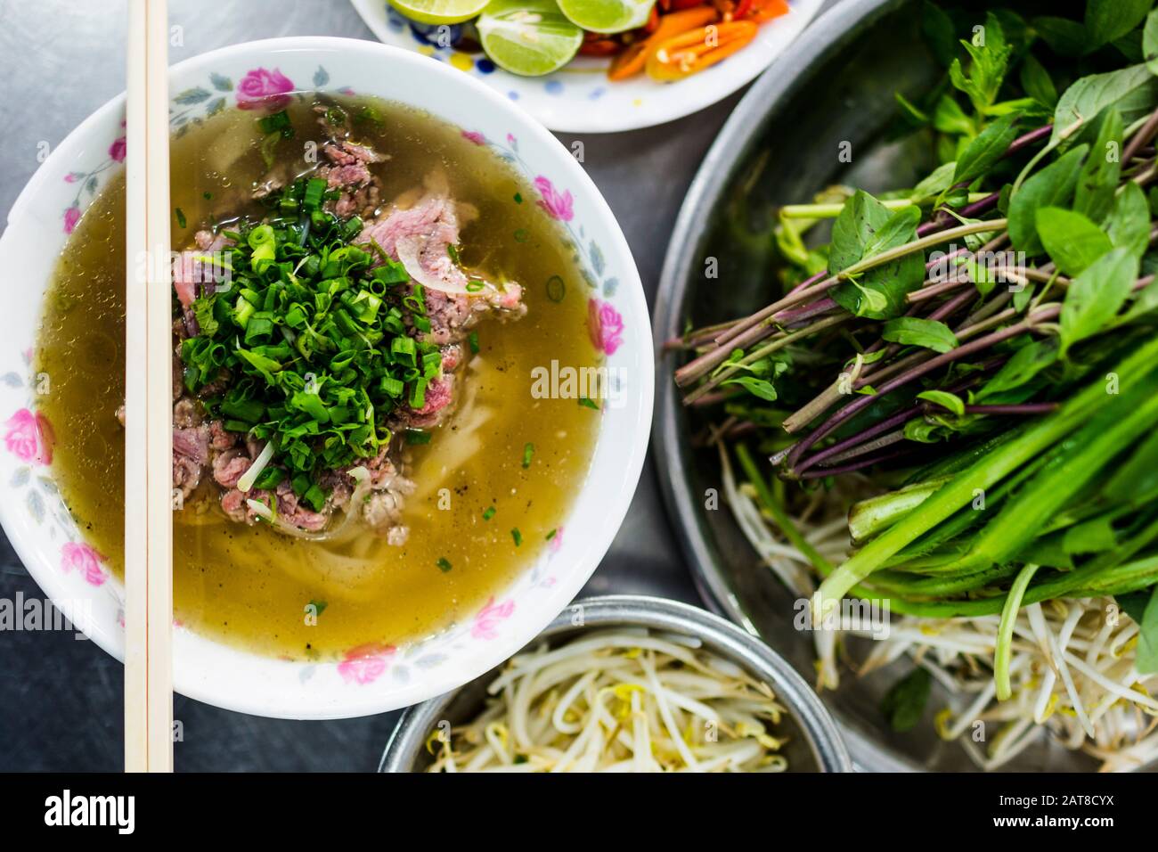 High angle close up of Beef pho, bowl of soup with beef, noodles and ...