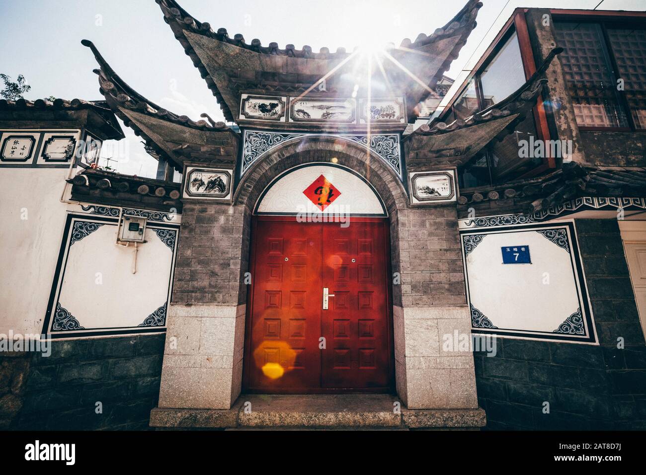 Exterior view of front door and roof of a traditional Chinese ...
