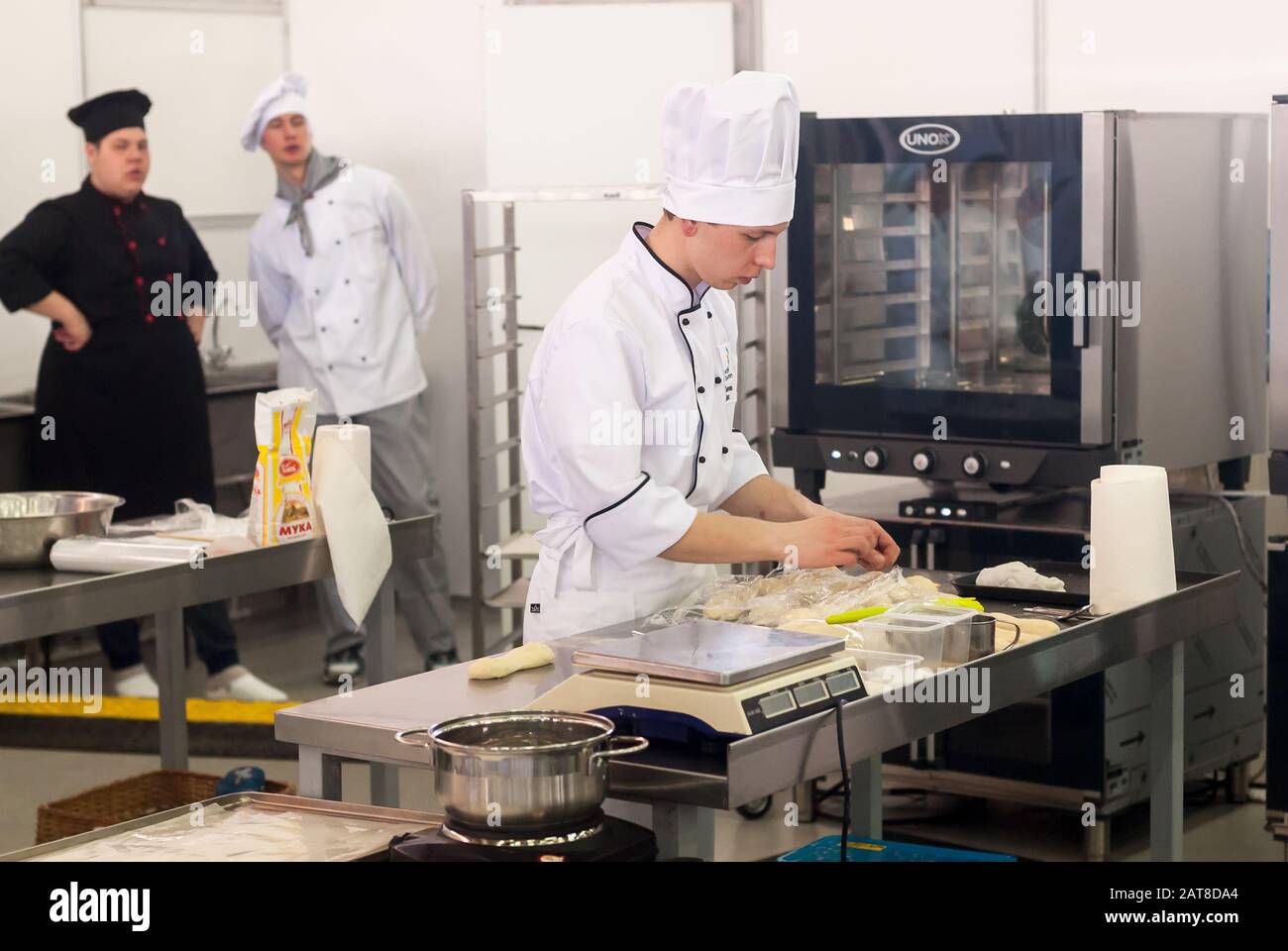 Young cook prepares food in competition Stock Photo - Alamy