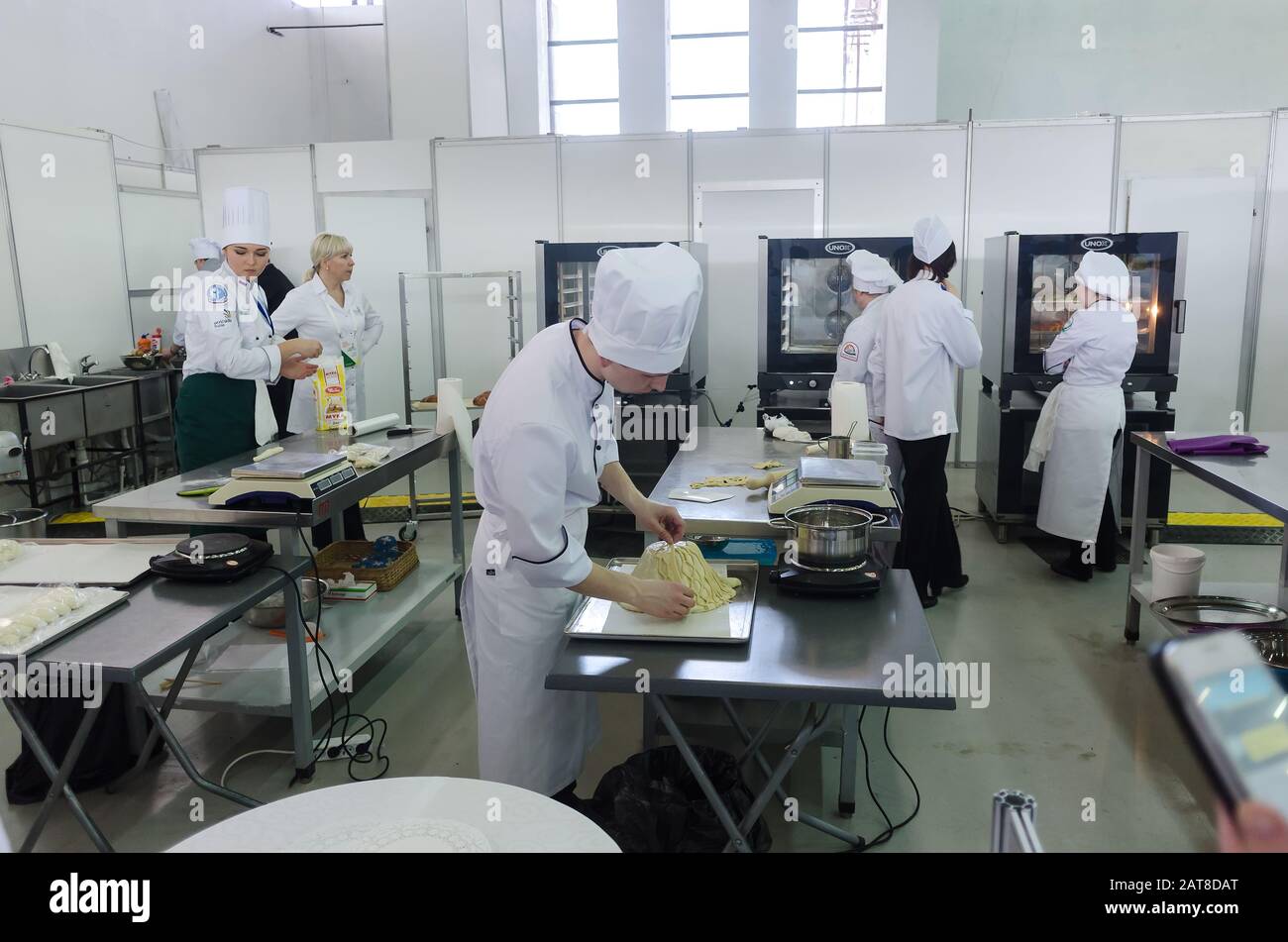 Young cook prepares food in competition Stock Photo - Alamy