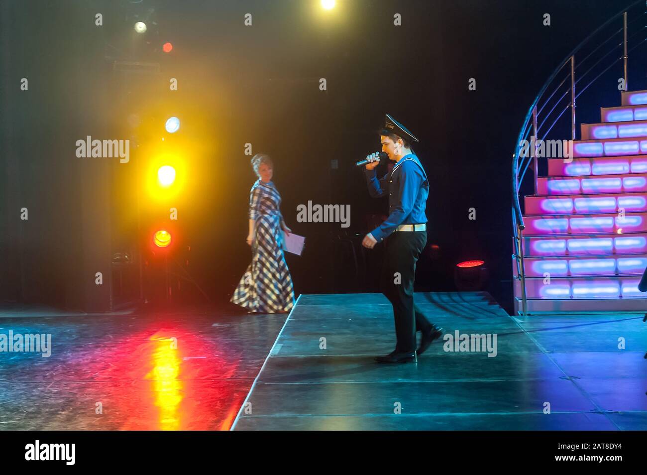 Beautiful man singing a song on stage Stock Photo - Alamy