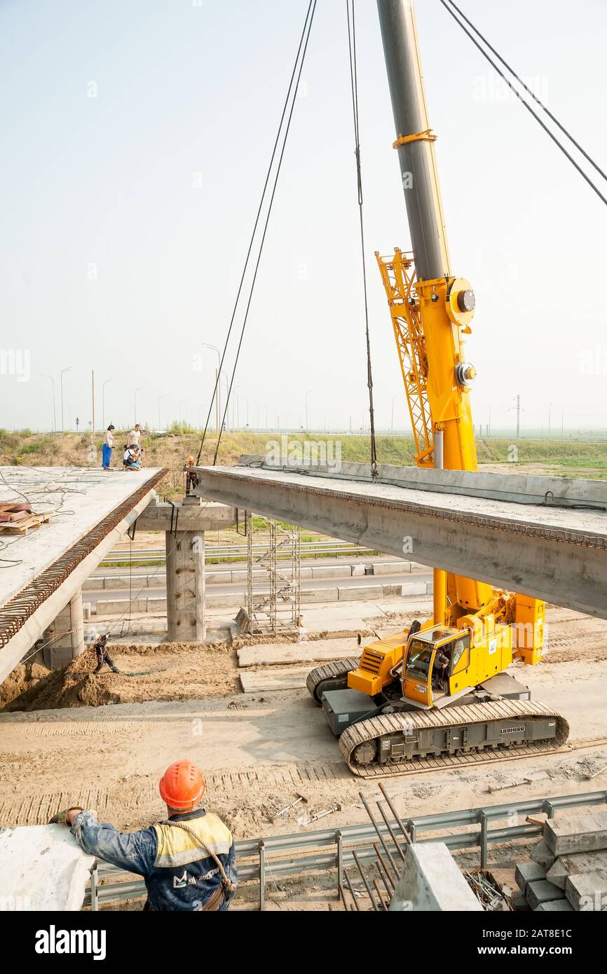Crane working on bridge construction Stock Photo - Alamy
