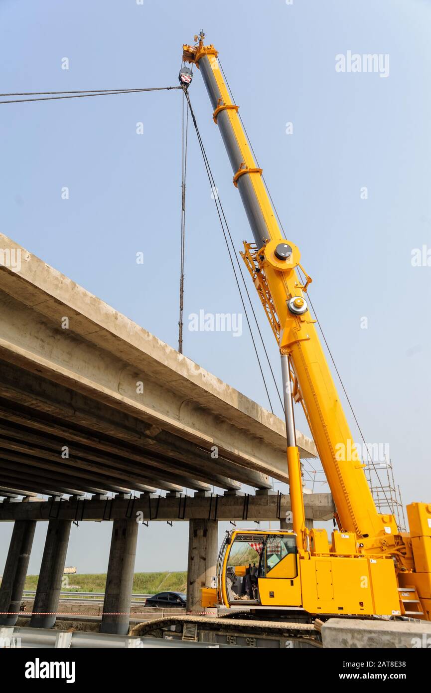 Crane working on bridge construction Stock Photo - Alamy