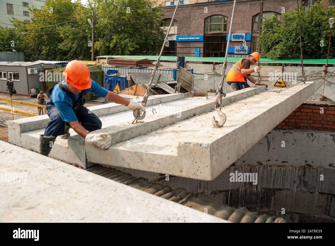 Builders working on residental house construction Stock Photo - Alamy