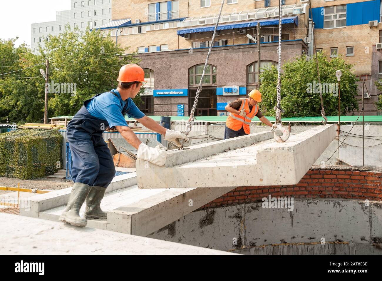 Builders working on residental house construction Stock Photo - Alamy