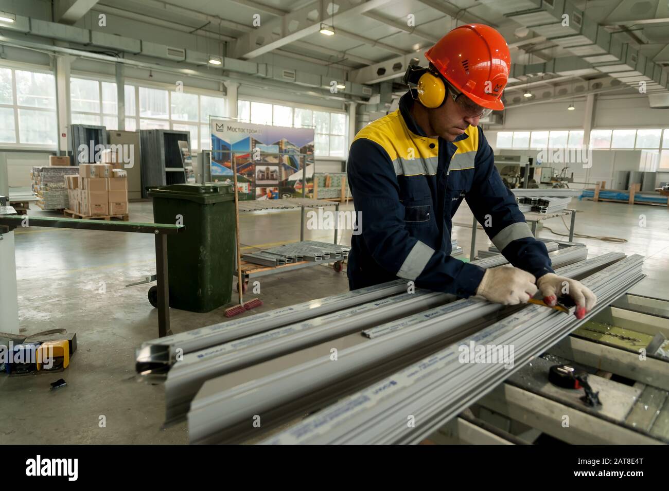 Worker manufacturing plastic window assembly hi-res stock photography ...