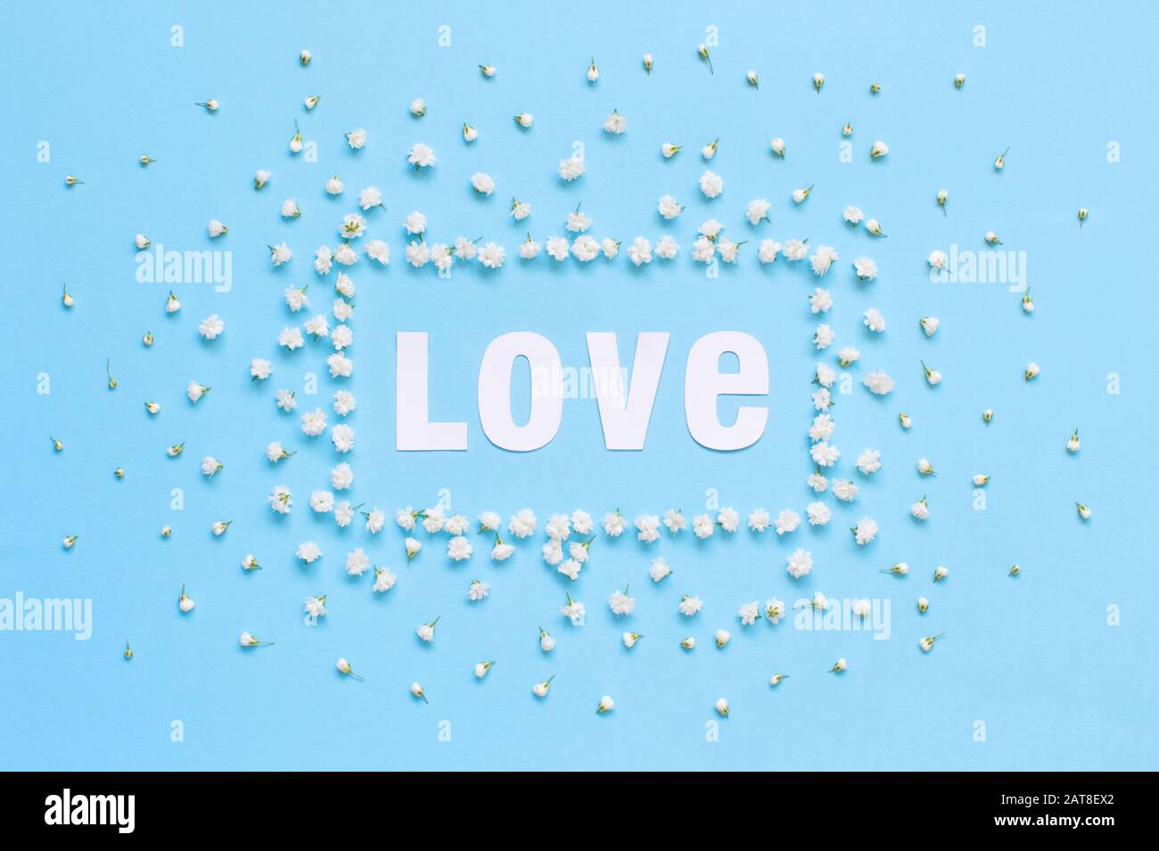 Rectangular floral frameand text LOVE on a light blue background top ...