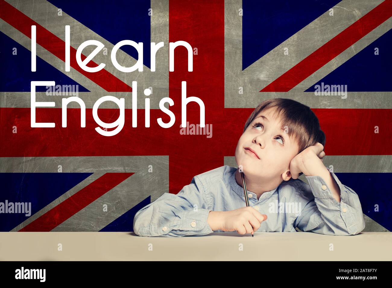 Happy smart child against the UK flag background. Learn English concept ...
