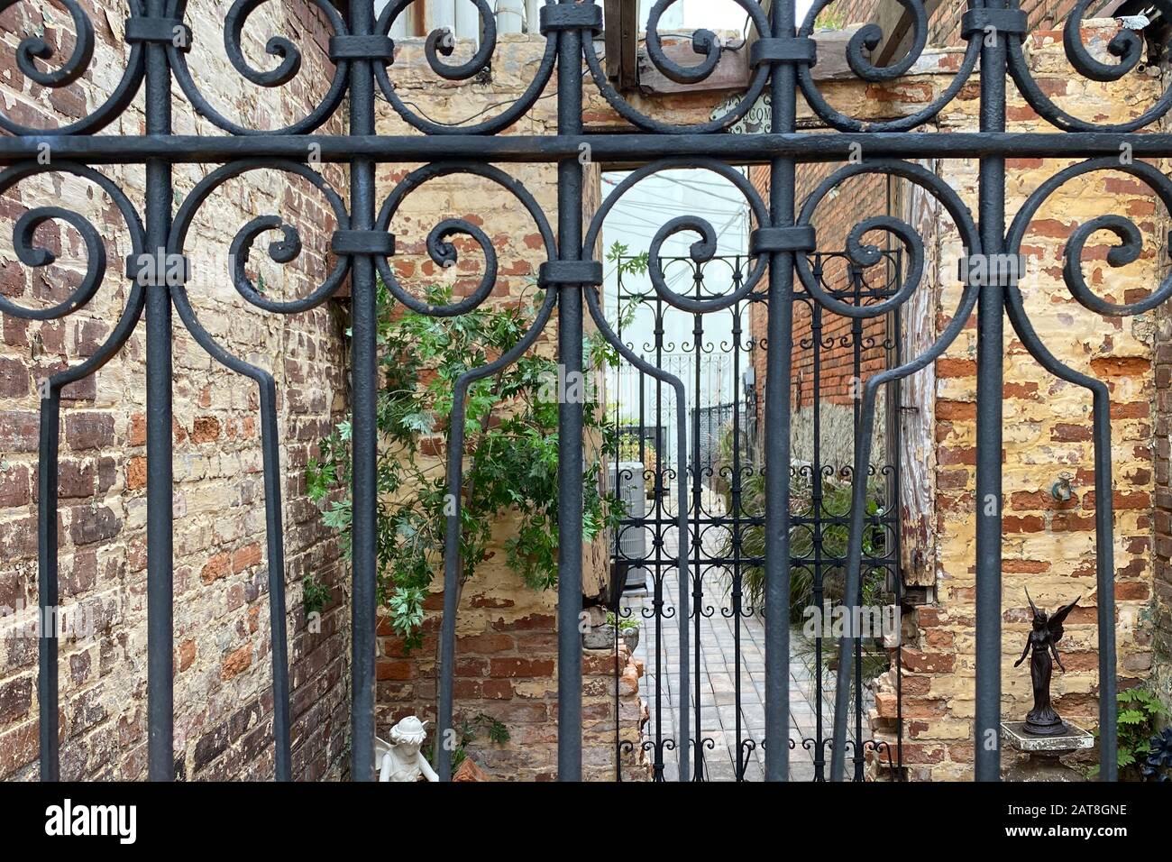 the entrance to a sanctuary with wrought iron gate Stock Photo - Alamy