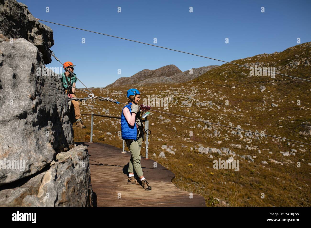 Couple ready to zip line Stock Photo - Alamy